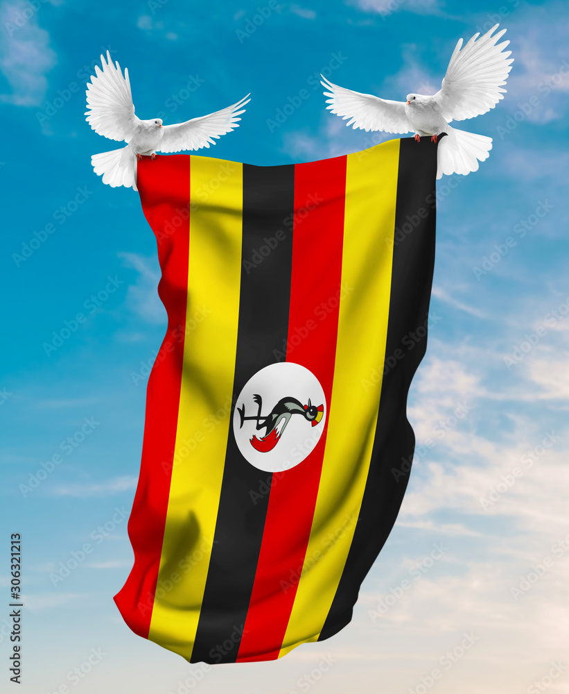 Uganda flag carried by white pigeon with sky background Stock Photo ...
