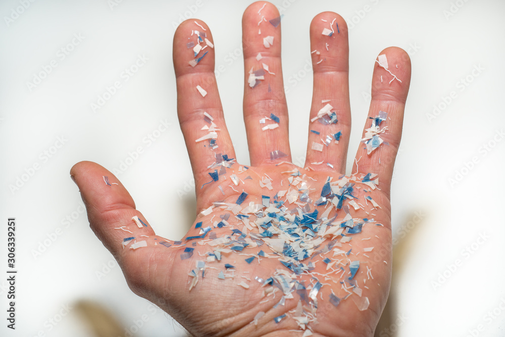 hand with microplastics Stock Photo | Adobe Stock