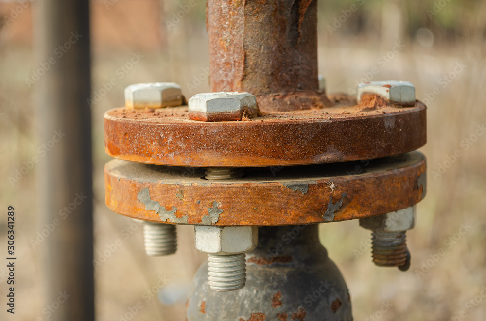 Close-up flange pipe connection. Rusty pipes of the heating main are ...