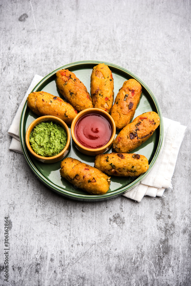 Veg Poha Roll made using flattened Rice, served with tomato ketchup and ...