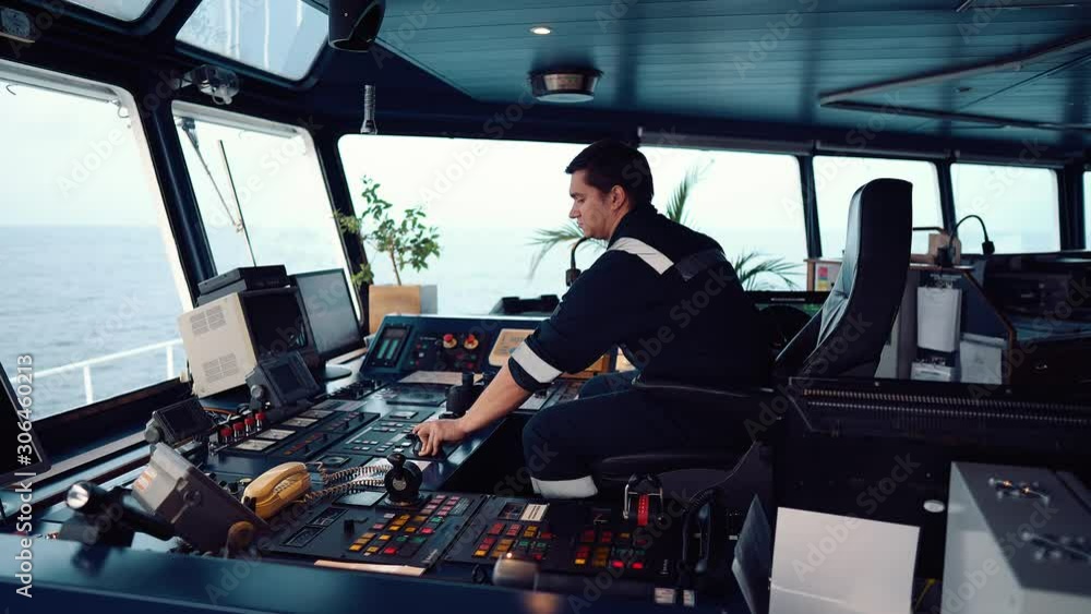 Marine navigational officer during navigational watch on Bridge . He is ...