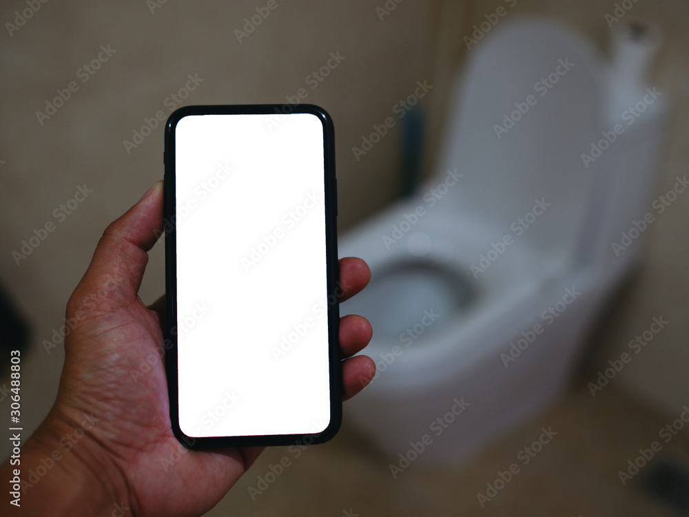 Smart phone with white screen background in toilet, restroom or WC ...