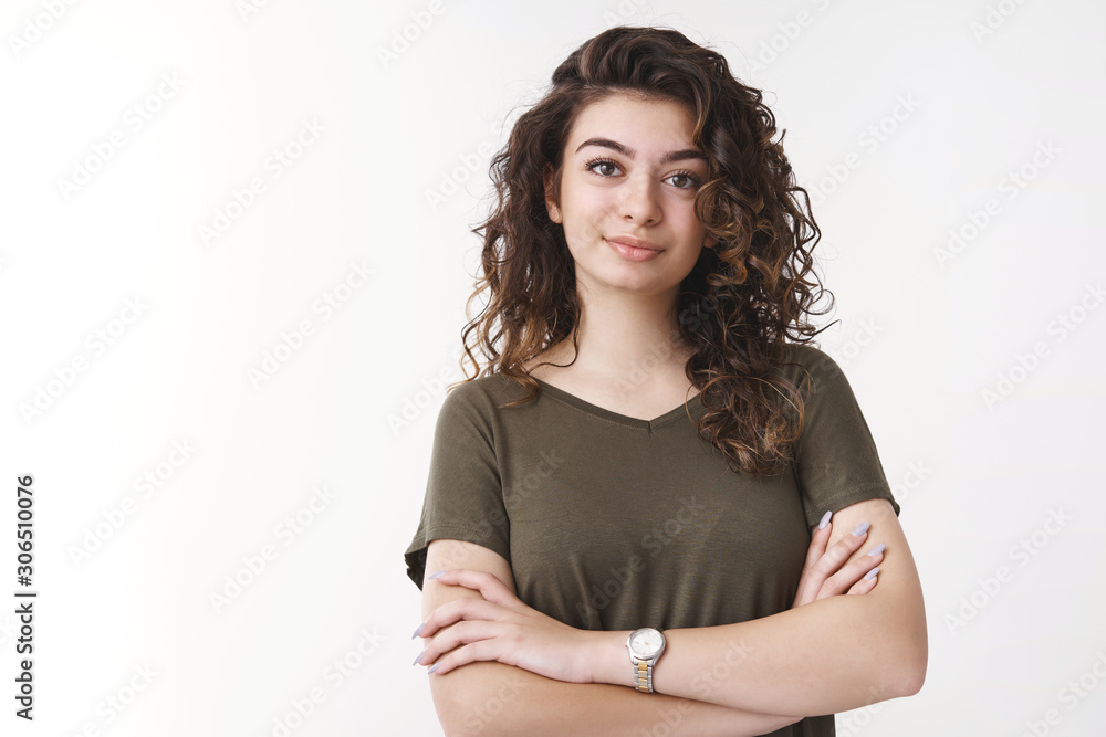 Confident skilfull attractive armenian curly-haired female employee ...