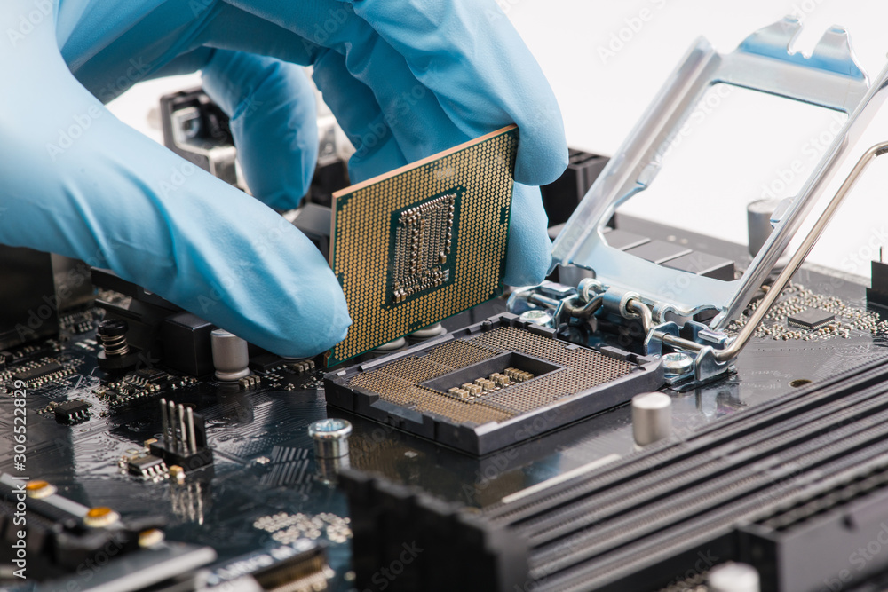 Male hand install cpu processor into motherboard Stock Photo | Adobe Stock