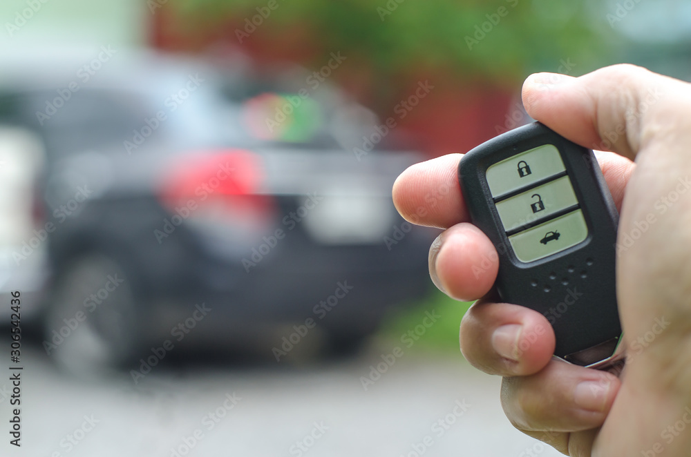 Car smart key is an electronic access and authorization system, Hand ...