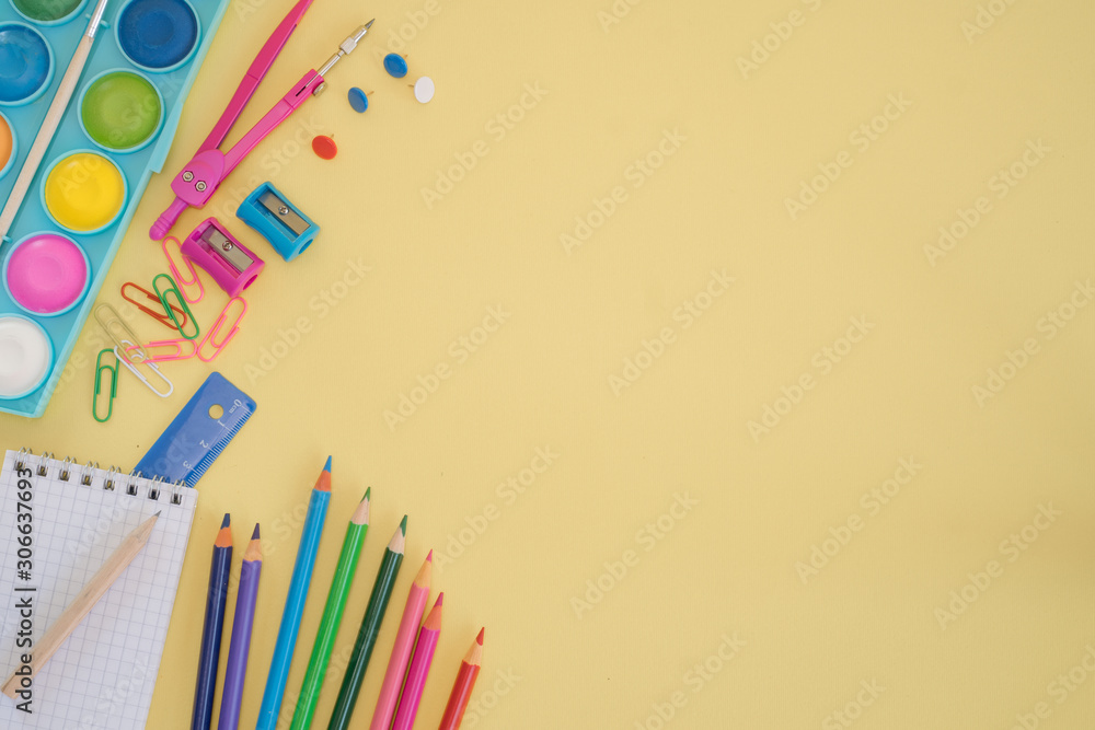 School or office yellow desk table background. Blank sheet of paper and ...