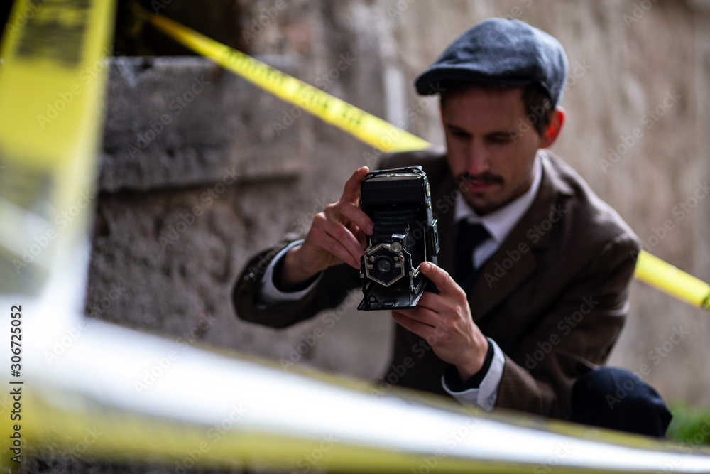 Vintage detective photographating the crime scene Stock Photo | Adobe Stock