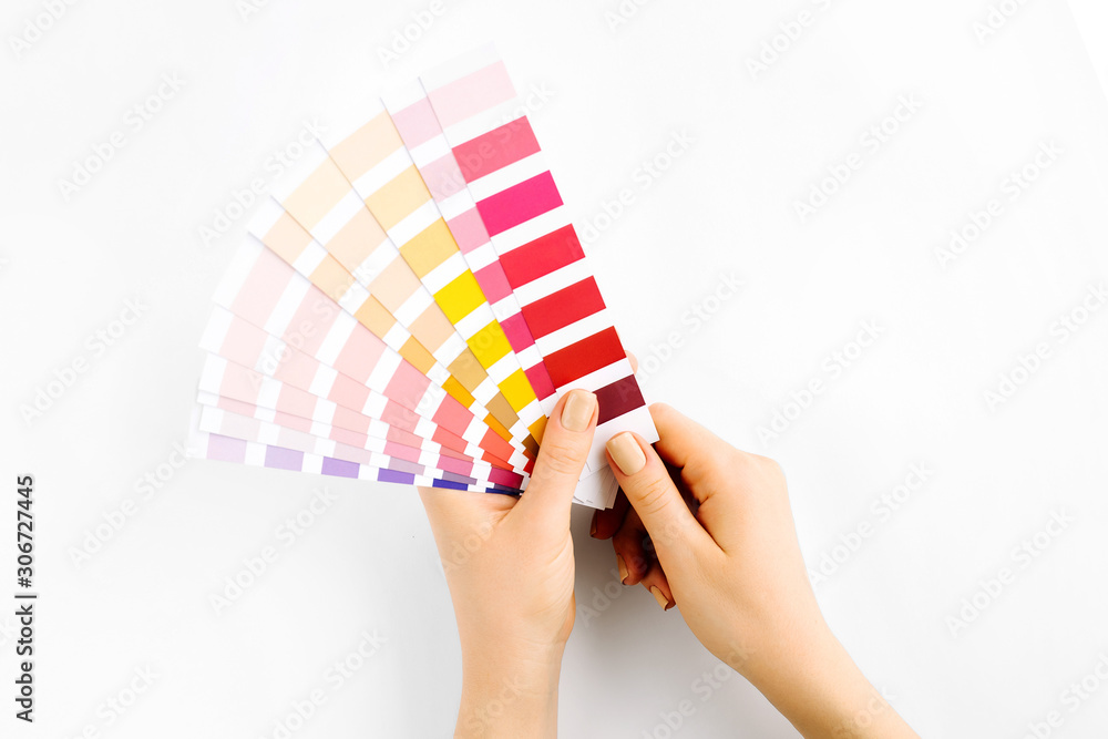 Female hand holding color swatches. Color trend palette. Flat lay, top ...