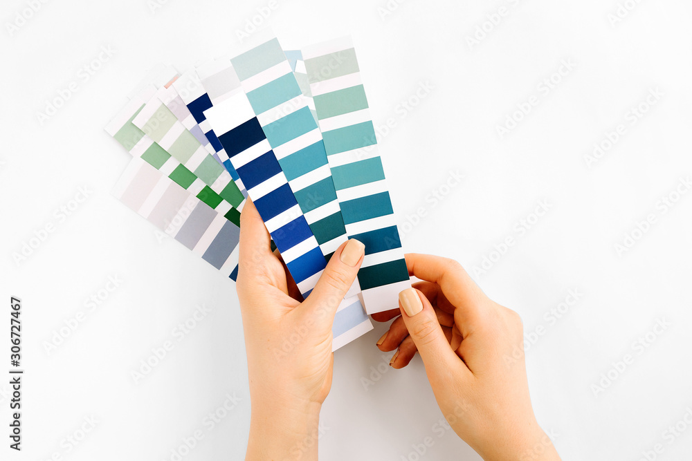 Female hand holding color swatches. Color trend palette. Flat lay, top ...