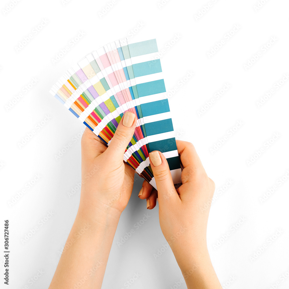 Female hand holding color swatches. Color trend palette. Flat lay, top ...