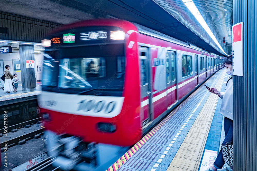 Metro in Japan. Tokyo Metro train passing the station. Keikyu subway ...