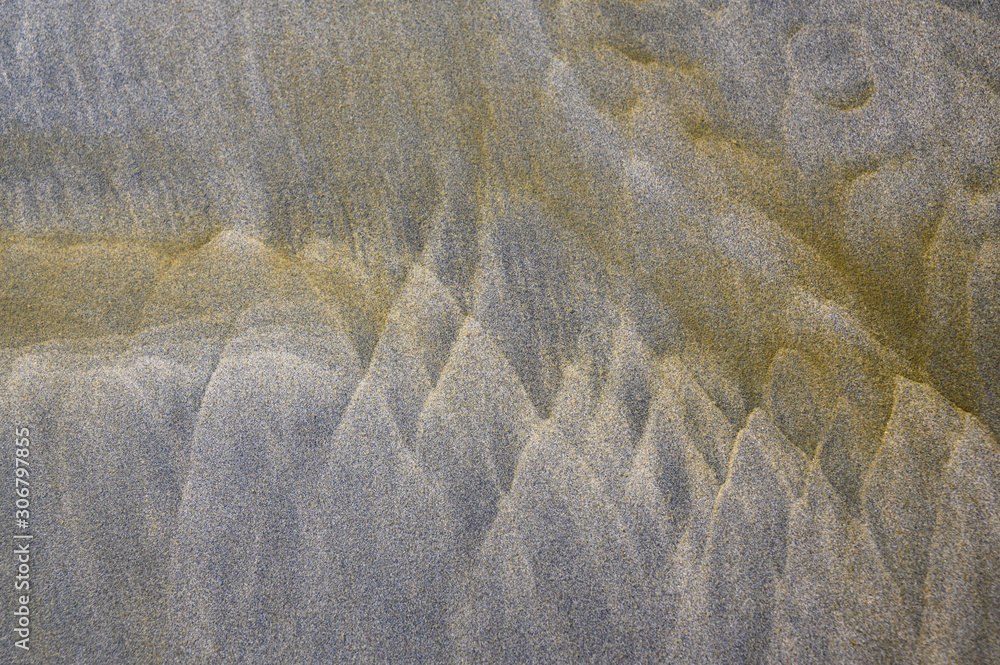 Pattern and texture in the wet sand and water as a nature background ...