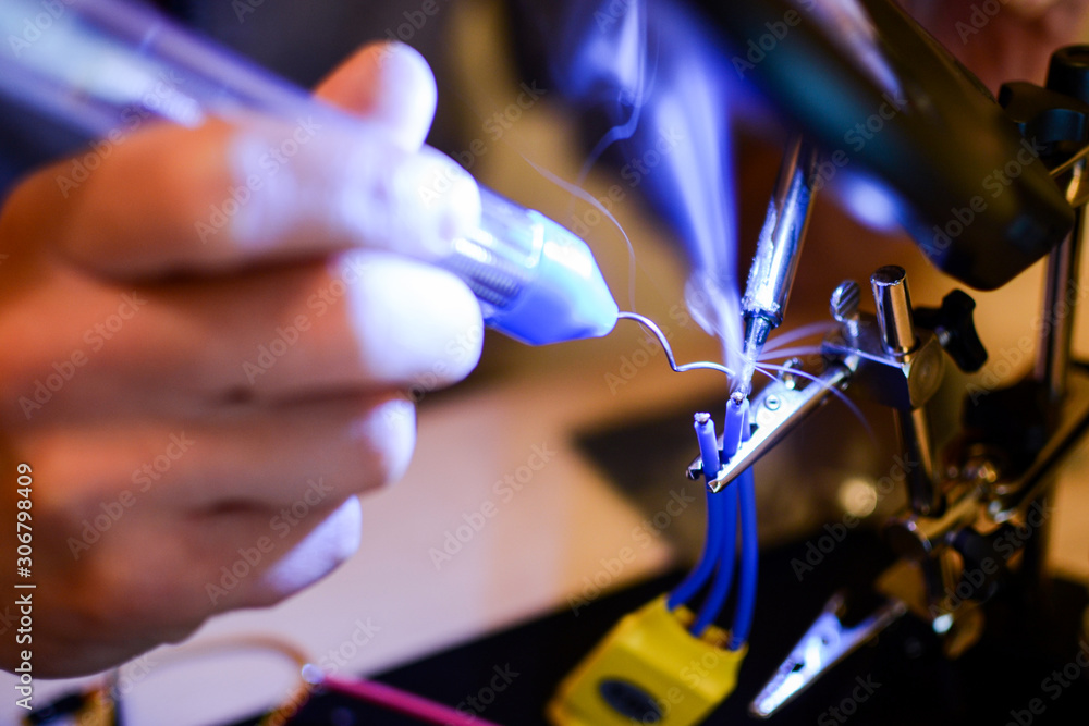 Smoke appears while soldering ESC and rotor wires with helper hands ...