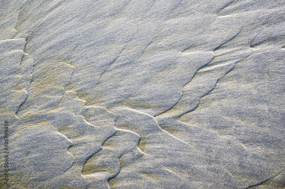 Pattern and texture in the wet sand and water as a nature background ...