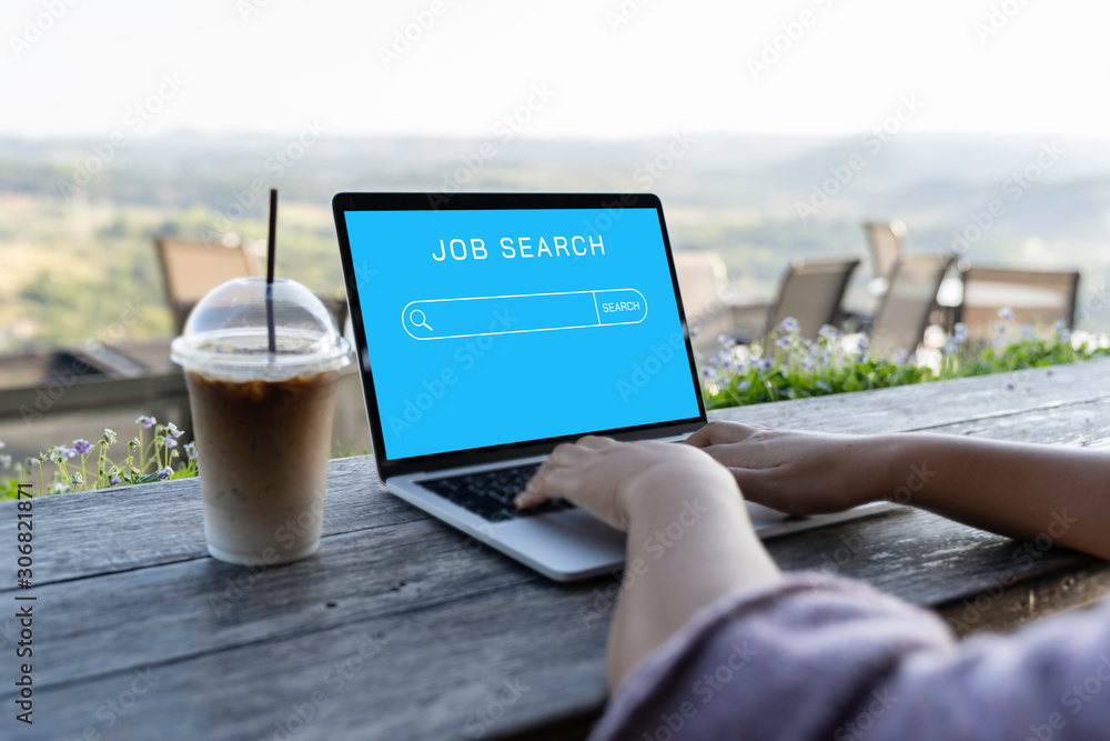 Business woman's hands with Laptop computer are looking for a new job ...