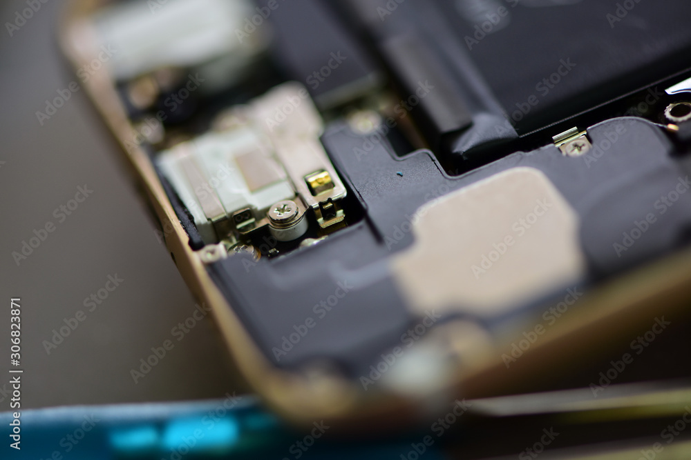 technician repairing broken mobile phone close-up.Close-up Of A Human ...