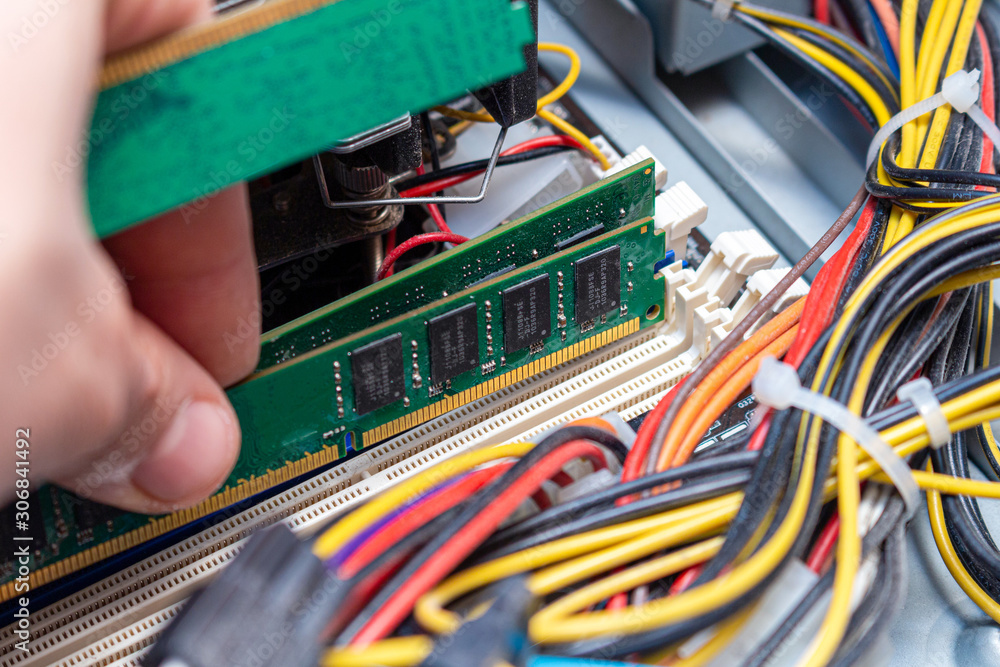 Installing ddr dimm memory, assembling personal computer in a service, hand upgrade. Stock Photo ...