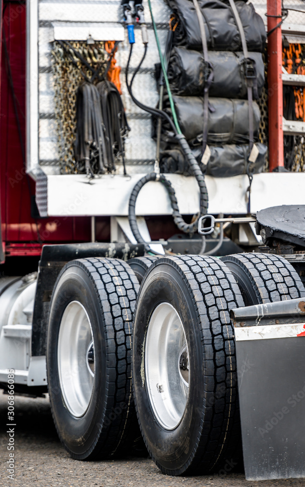 Back of the big rig semi truck with wheel axels and accessories with ...