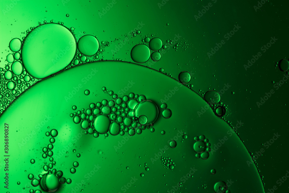 abstract science background, backlit green liquid biology or chemistry ...