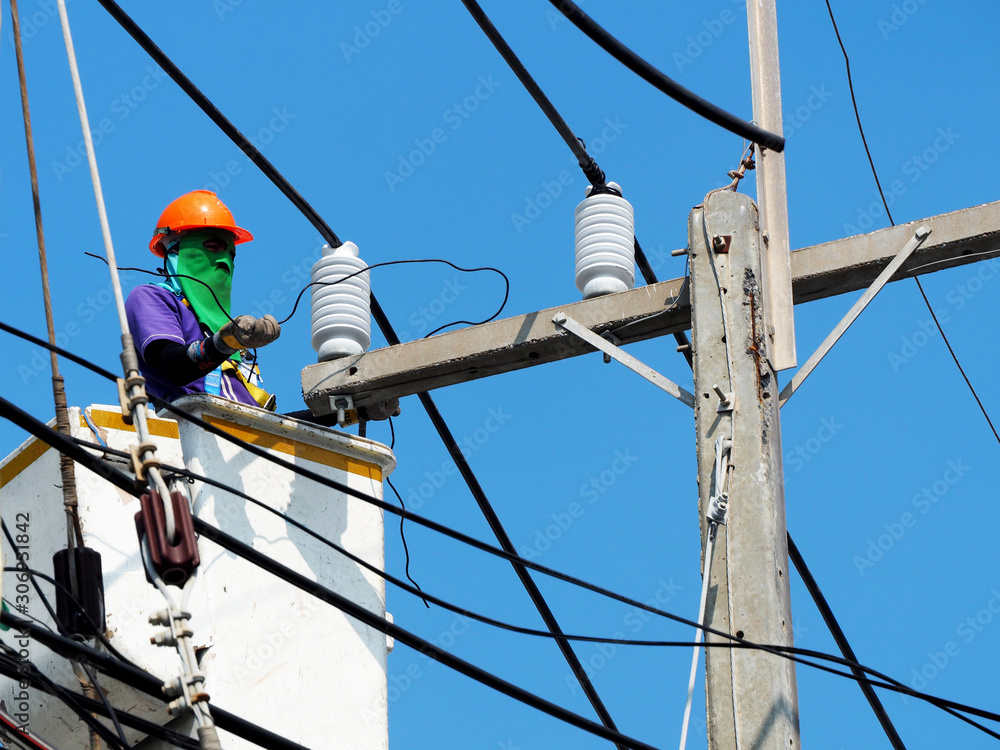 electrician man working at height and dangerous ,high voltage power ...