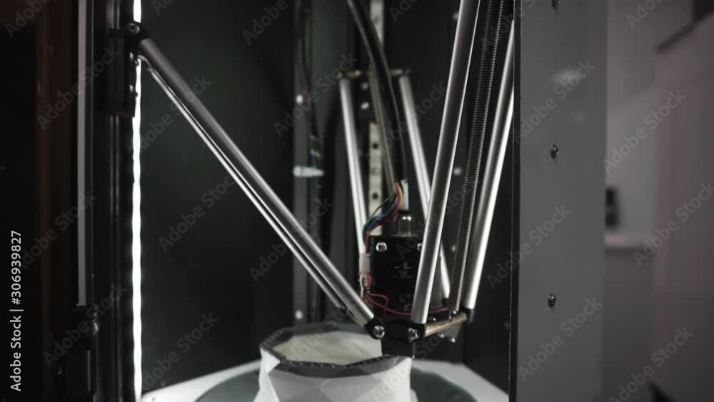 3D printer is working. Modeling using a 3D printer. 3D printer prints ...