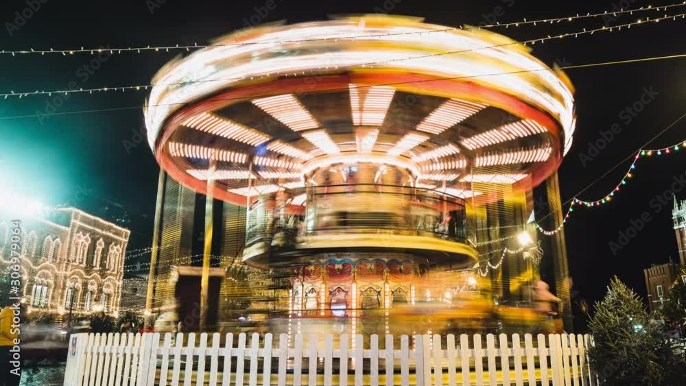 Merry-go-round carousel at night. Amusement park carousel with ...