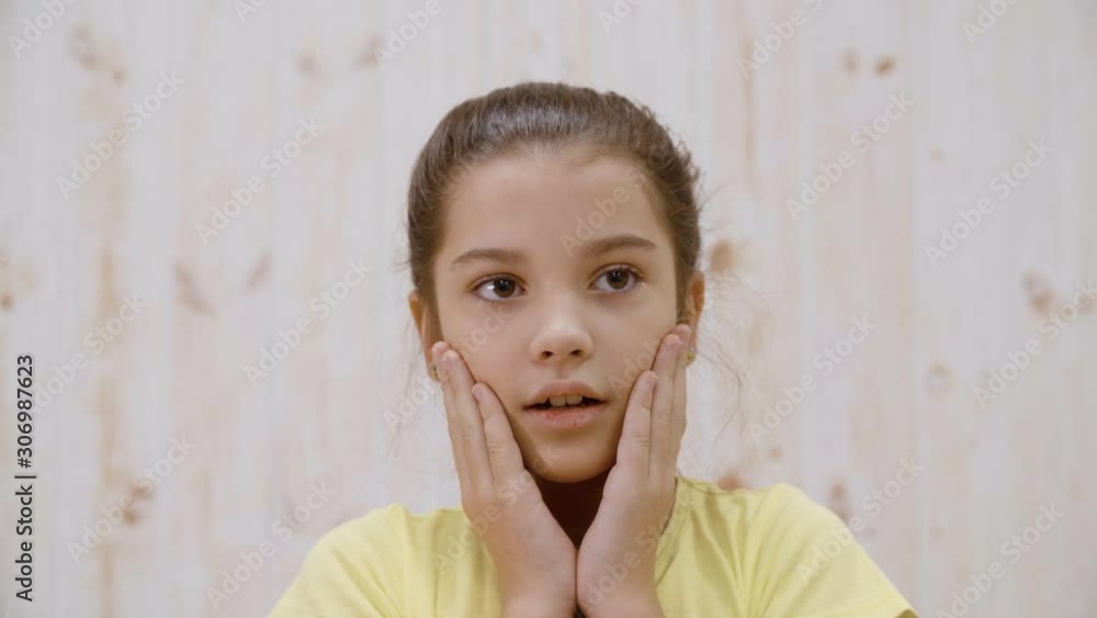 Girl with surprised facial expression standing with open mouth and ...