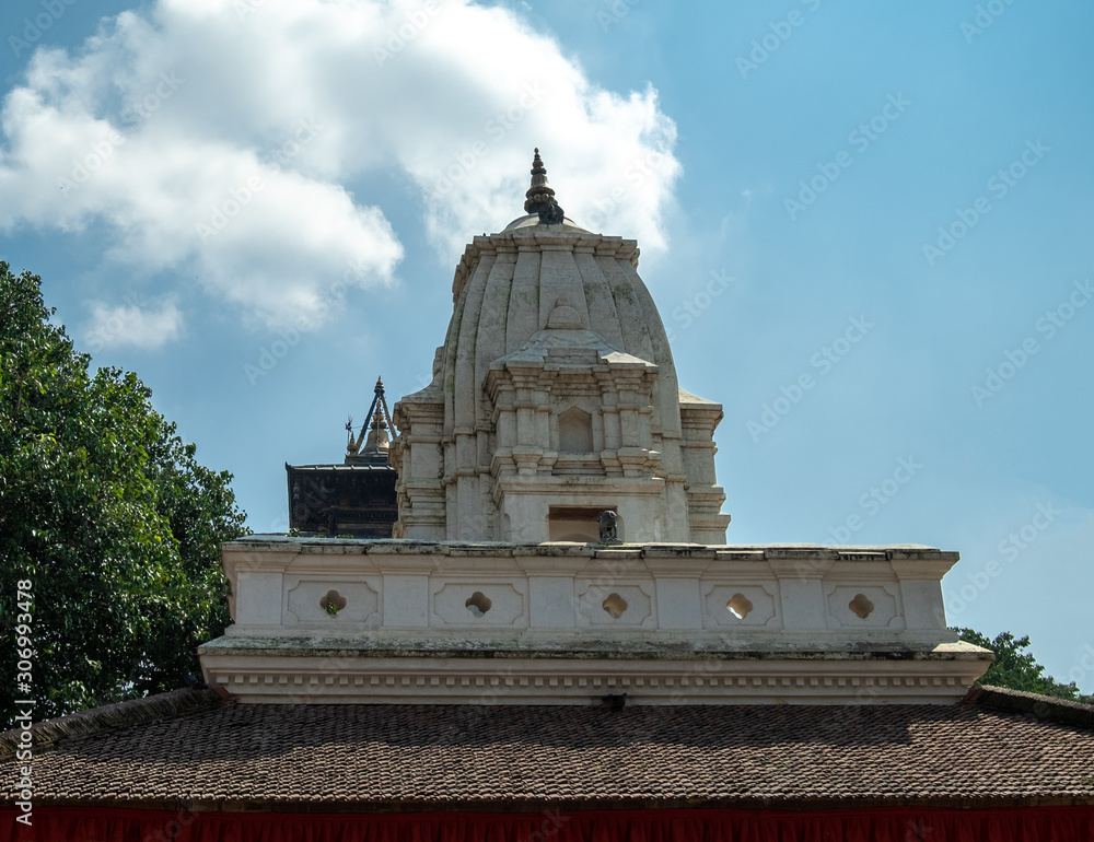 Shikhara (peak) of a Hindu temple against the blue sky in Durbar Square ...