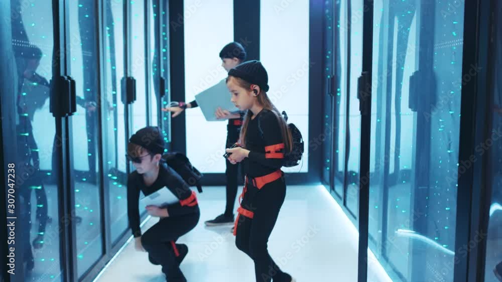 Team of professional kids agents sneaking into secure server room ...