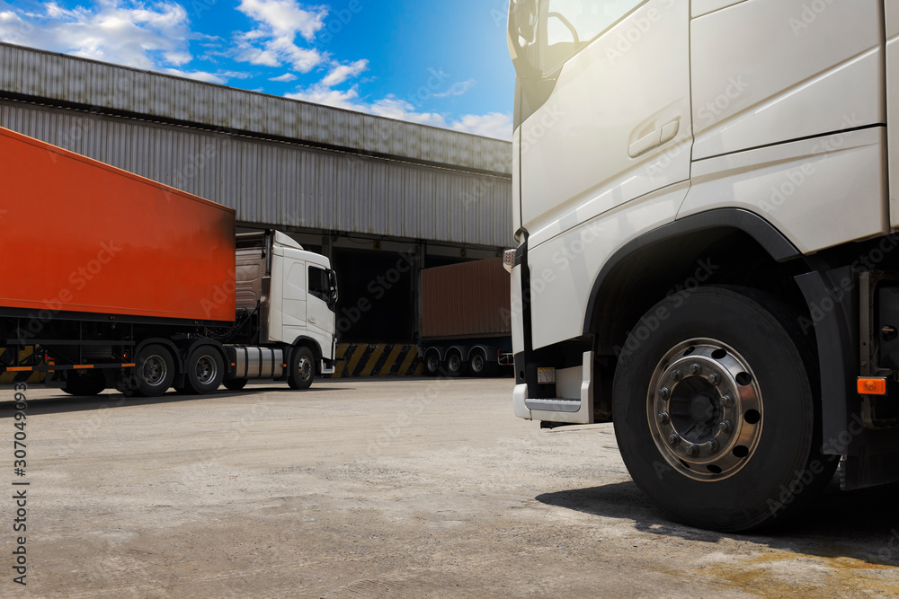 The truck trailer loading shipment goods at distribution warehouse ...