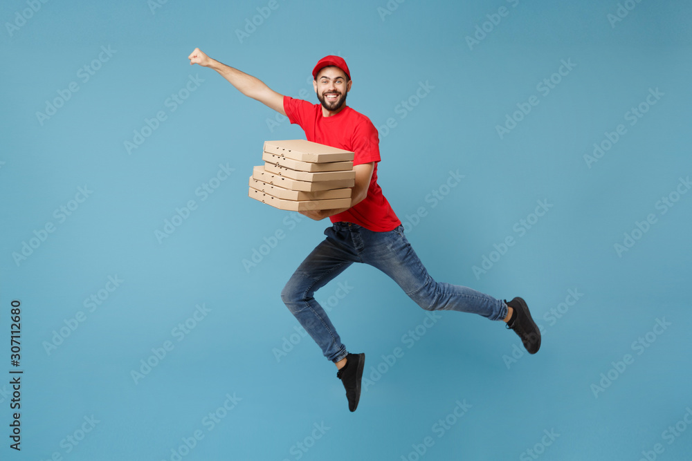 Delivery man in red workwear giving food order pizza boxes isolated on ...