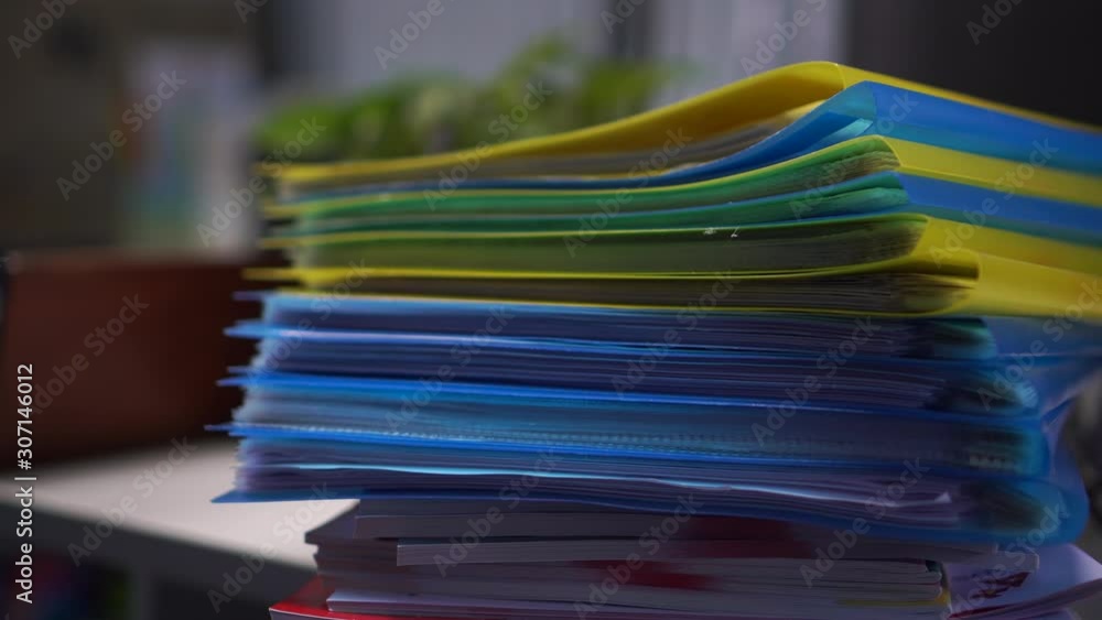 Pile or Stack of file folders with documents binder on desk office ...