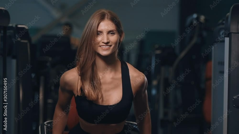 fitness pretty caucasian woman pumping up muscles chest pectorals ...