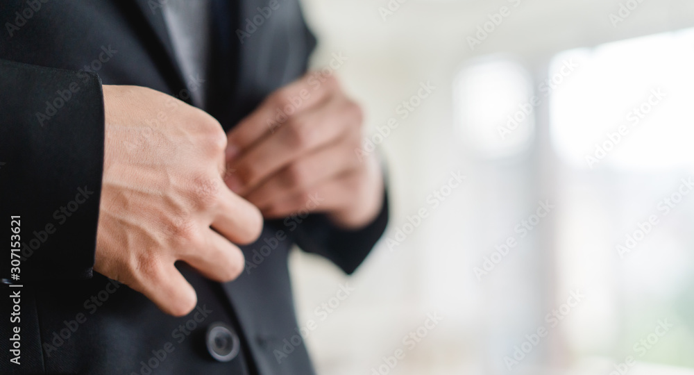Closeup hands of business man fitting suit with tailor.Hands on button ...