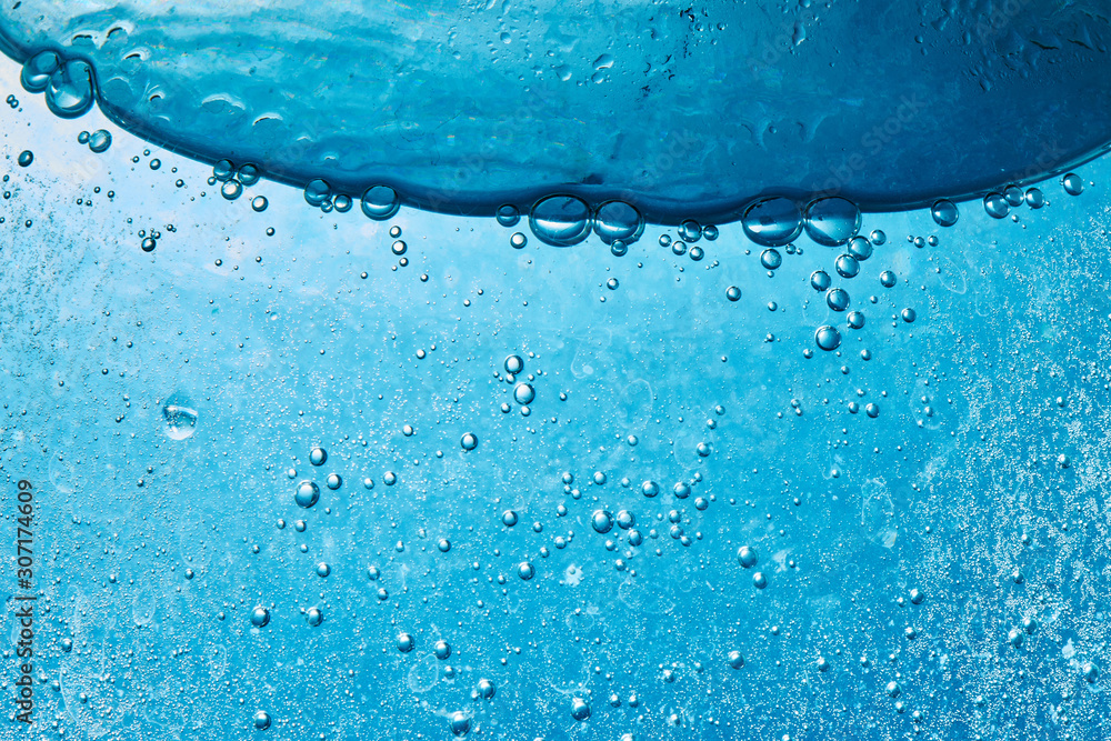 Sparkling Mineral Water Background. Blue bubbles of fresh soda float to ...