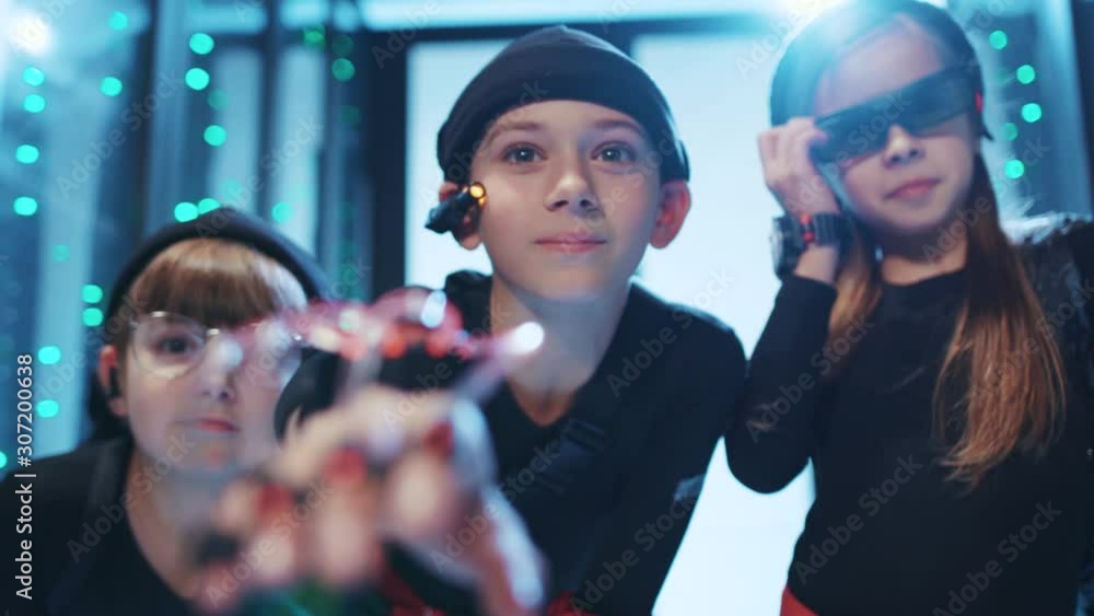 Team of young curious hackers sneaking into server room of data center ...