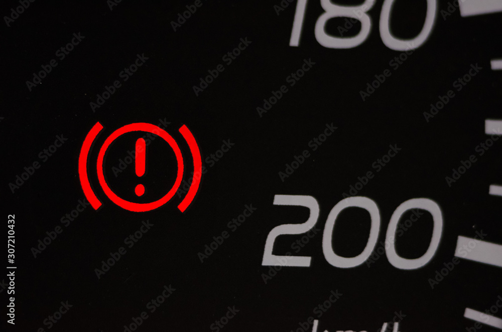 Parking brake indicator lamp in the dashboard of the vehicle is lit in ...