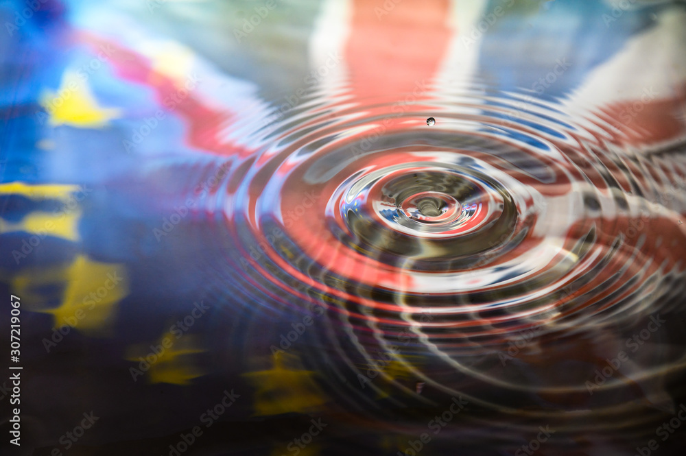 UK Union Jack and European Union EU flags reflected in water splash ...