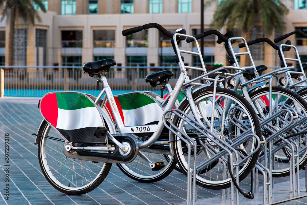 Dubai, United Arab Emirates - December 11, 2018: Rental bicycles with ...