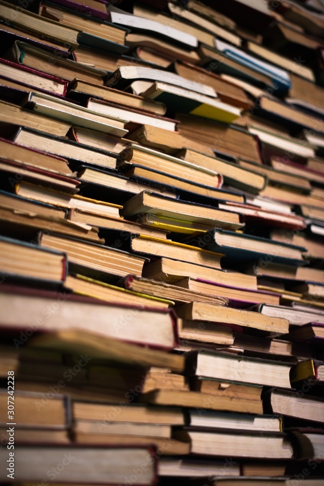 A huge pile of different books in the library. A library full of books ...