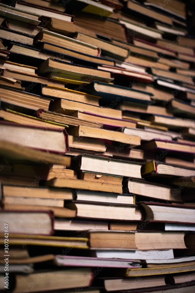 A huge pile of different books in the library. A library full of books ...
