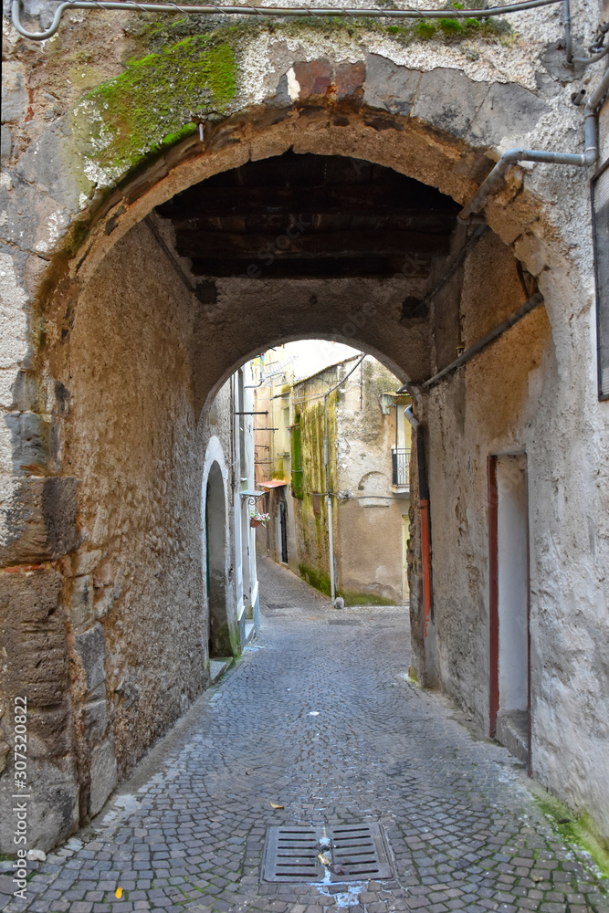 Teano, Italy, 11/30/2019. A street among the old houses of a medieval ...