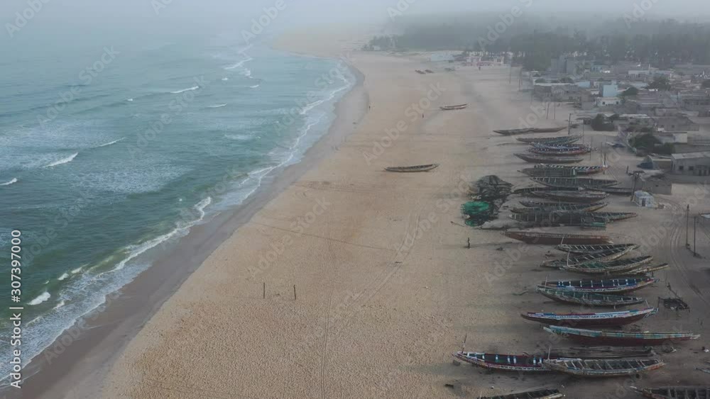 Vidéo Stock Aerial view of fishing village, pirogues fishing boats in ...