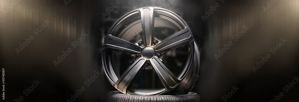 beautiful black alloy wheels made of aluminum on a dark background ...
