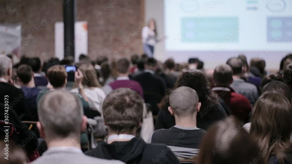 Vidéo Stock Adult people at conference listen to woman speaker ...