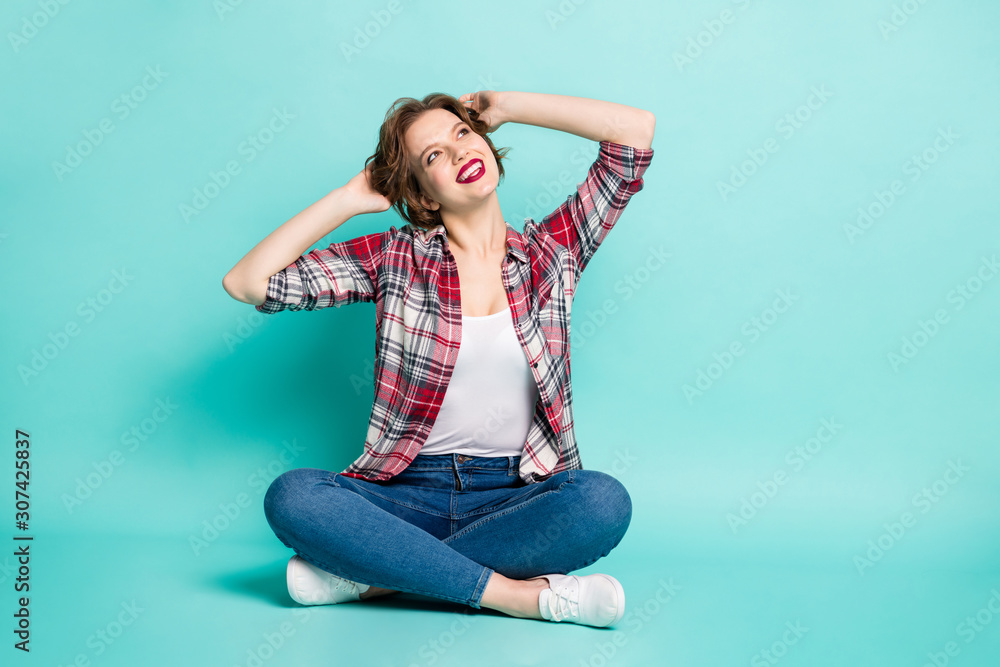 Full size photo of content millennial girl sit legs crossed touch her ...