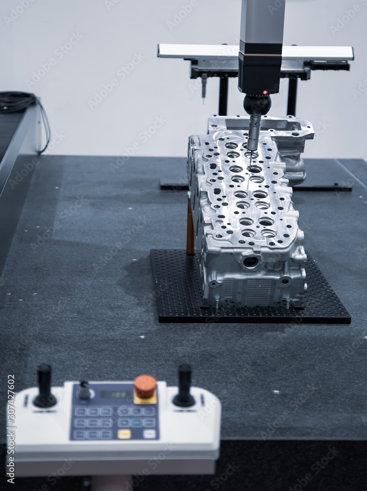 CMM Coordinate Measuring Dimension Machine inspecting engine part in ...