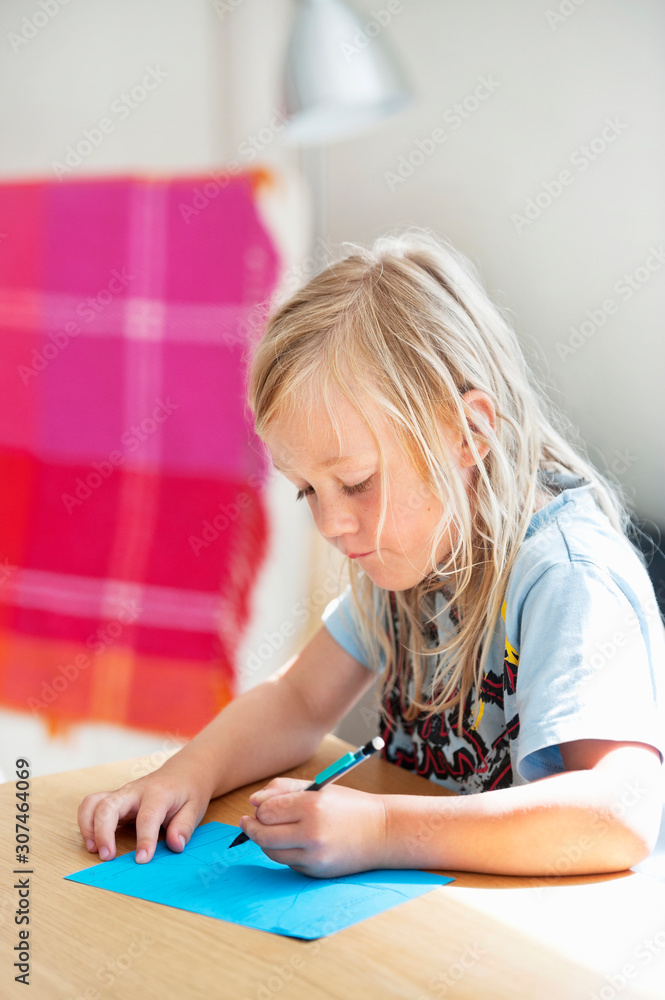 Girl writing Stock Photo | Adobe Stock