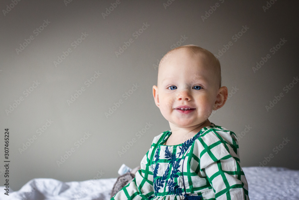 smiling happy baby with grey background Stock Photo | Adobe Stock