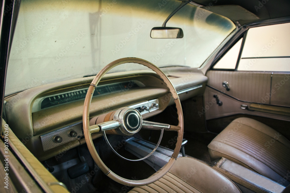 Old, classic car inside a garage Stock Photo | Adobe Stock